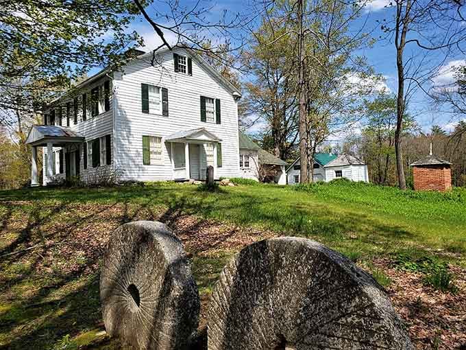 This classic white colonial home rests on its hillside perch with the confidence of old money.