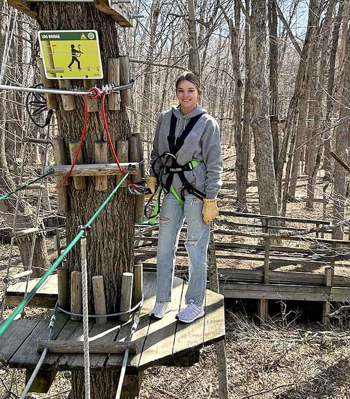 Harness clipped, smile ready, and the Log Bridge sign means business is officially about to begin.