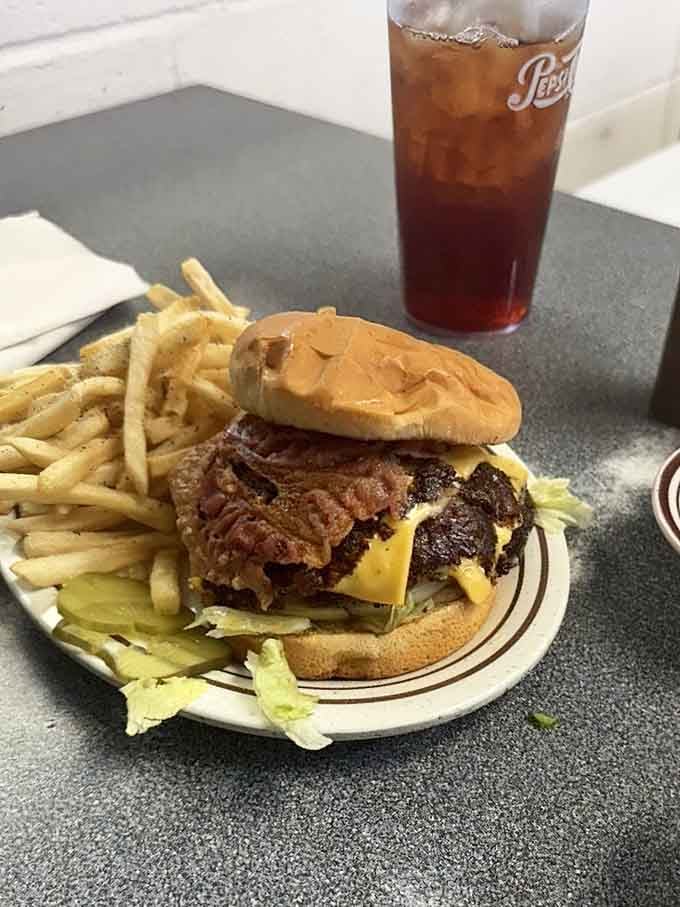 Bacon, cheese, two patties, and a pile of fries. Some meals just demand your full attention.