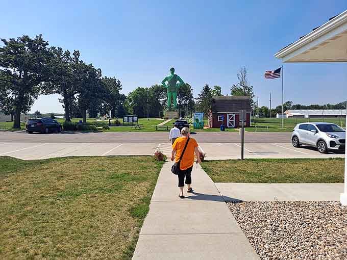 Nothing says "great road trip decision" quite like walking toward a 55-foot green man on a sunny afternoon.