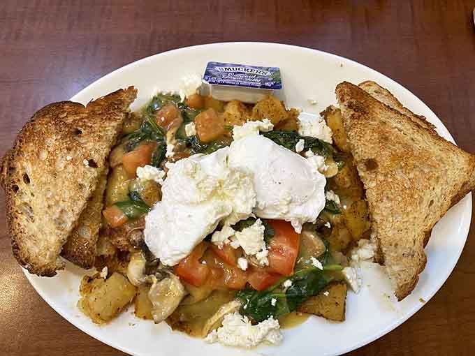Poached eggs, crumbled feta, spinach, and tomatoes. Eggs Florentine that makes healthy eating feel like an absolute treat.