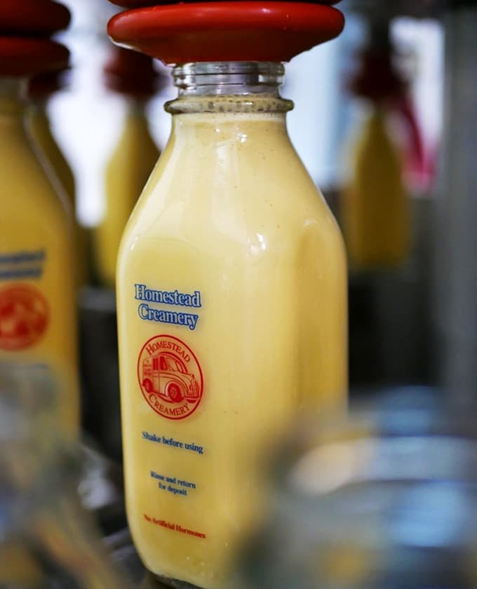 Golden, rich, and sealed with a cheerful red cap, this eggnog in a glass bottle looks like the holidays decided to show up early.