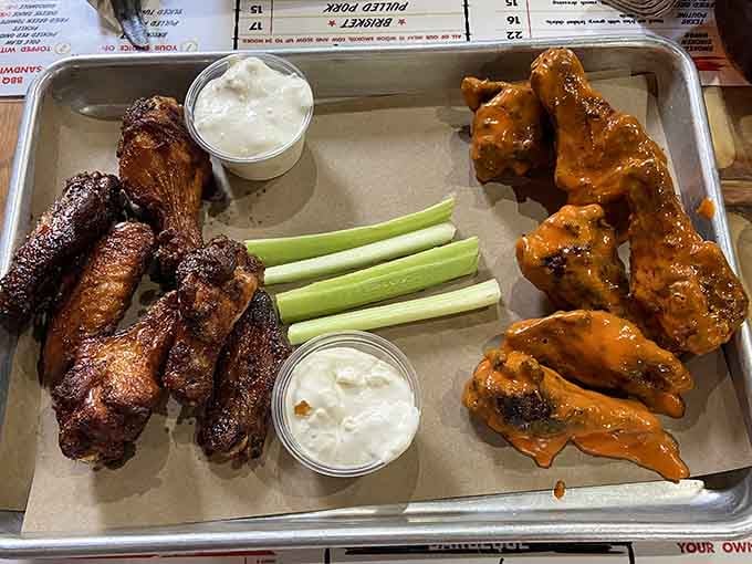 Smoked wings served two ways, with celery and dipping sauces ready. The hardest part is choosing a side.