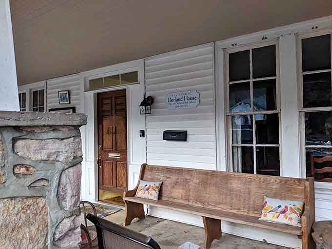 The Historic Dorland House porch bench practically begs you to sit down and stay a while.