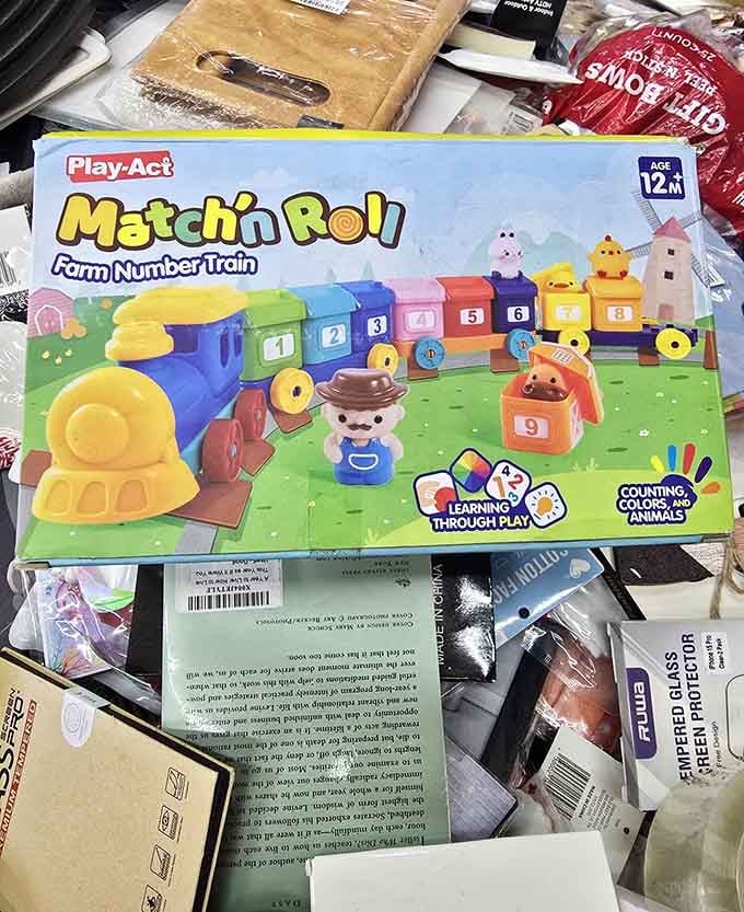 A Play-Act Farm Number Train tucked among the chaos, because the best kids' gifts sometimes come from the most surprising spots.