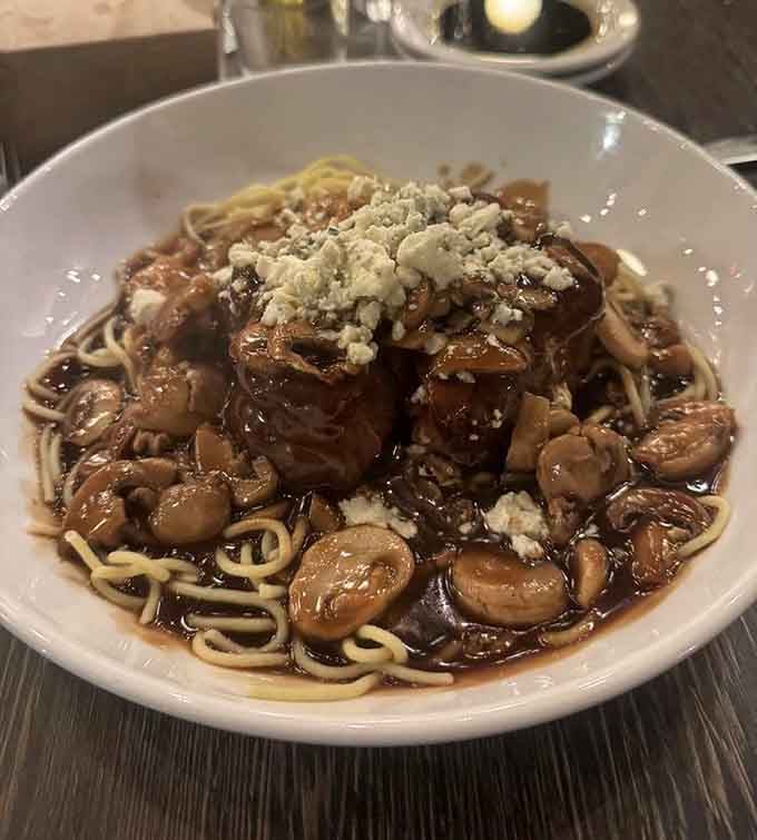 That rich, glossy sauce pooling around the pasta tells you everything you need to know before the first bite.