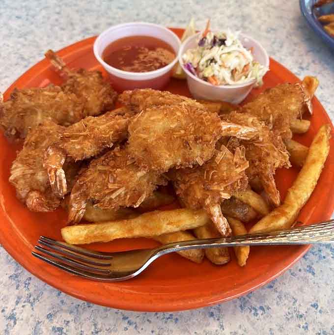 Coconut shrimp piled high with that sweet chile sauce waiting on the side. Go ahead, you've earned it.