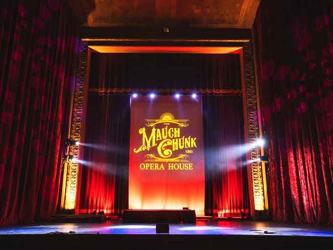 Red velvet curtains, dramatic lighting, and a stage that's been hosting performances since the coal boom days.