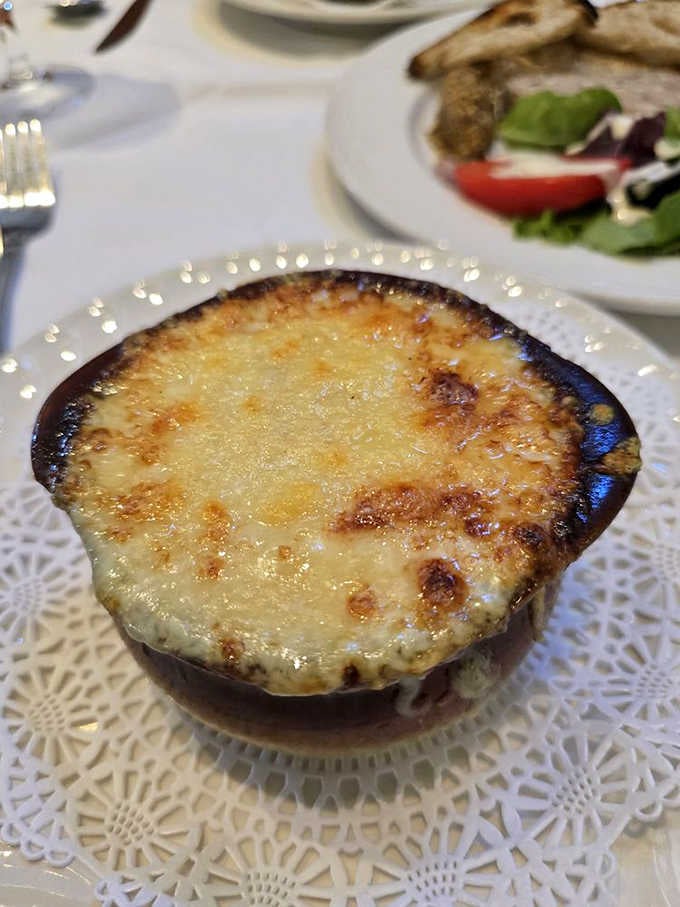 French onion soup with a golden, bubbling cheese crust so beautiful you'll feel guilty breaking through it. Almost.