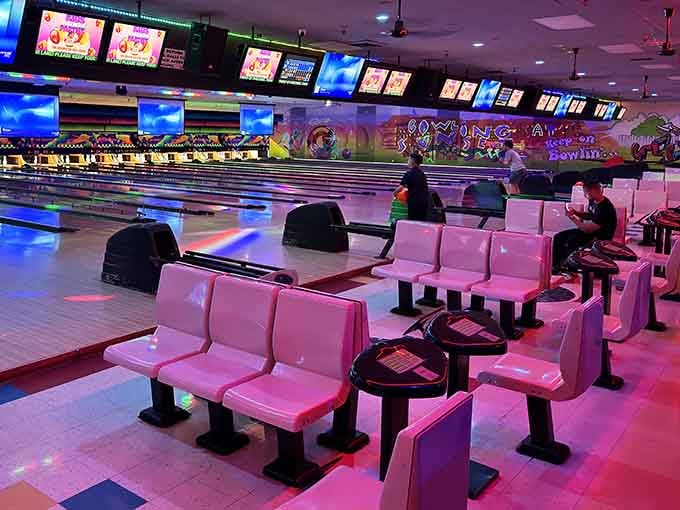 Pink seating and cosmic lighting create the perfect spot to cheer on your fellow bowlers.