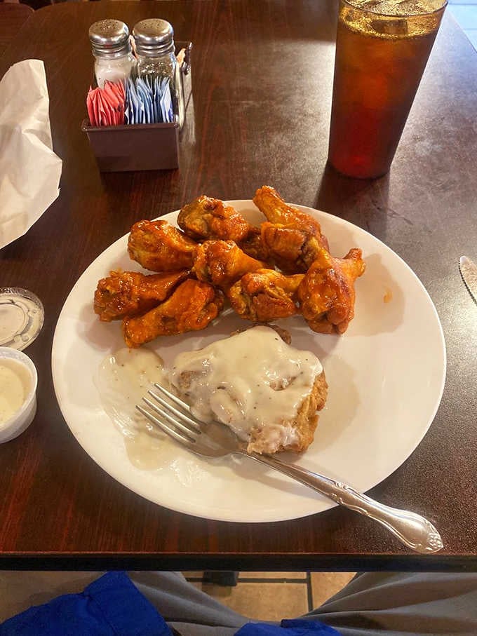 Hot wings and country fried steak with white gravy on the same plate, because Thursday deserves to be celebrated properly.