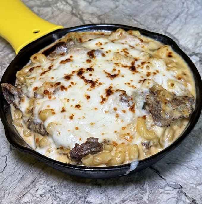 Philly cheesesteak meets pasta in this glorious fusion that somehow makes perfect sense once you taste it.