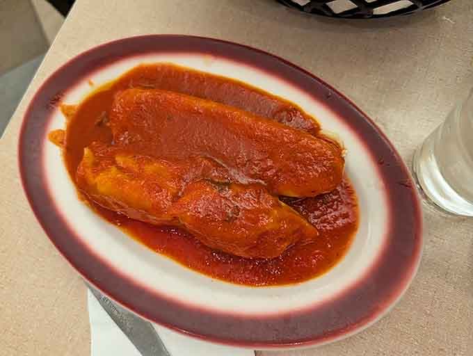 Mama Santa's Manicotti swimming in rich tomato sauce is the kind of dish that makes silence feel appropriate.