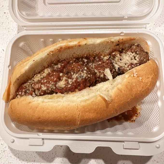 A meatball sub so generously loaded with sauce and cheese, it requires your full and undivided attention.
