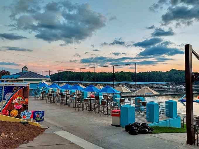 High-top tables, blue umbrellas, and a sunset that absolutely did not ask for permission to be this gorgeous.