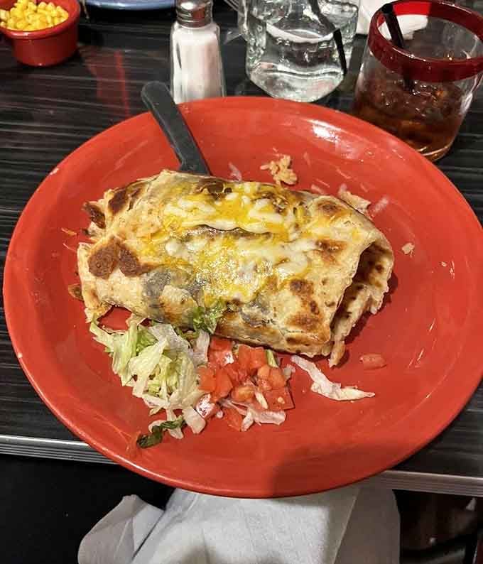 Carne asada perfection smothered in green chili that'll make you reconsider every burrito you've ever called "good."