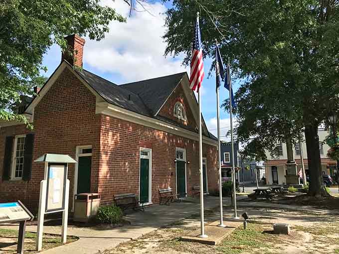 The Mathews County Courthouse Square: old brick, tall flags, and the kind of civic dignity that makes you stand up straighter.