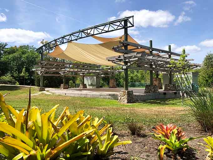 An open-air amphitheater surrounded by bromeliads and blue sky. Your next favorite outdoor concert venue awaits.