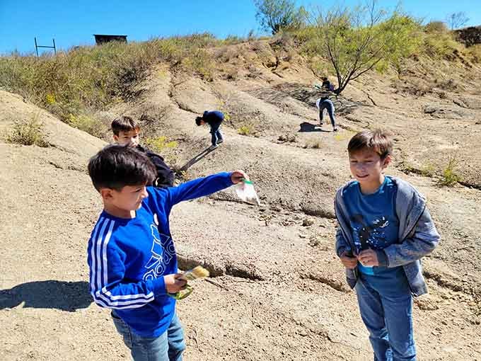 That grin says it all. Finding a 300-million-year-old fossil beats any video game, hands down.