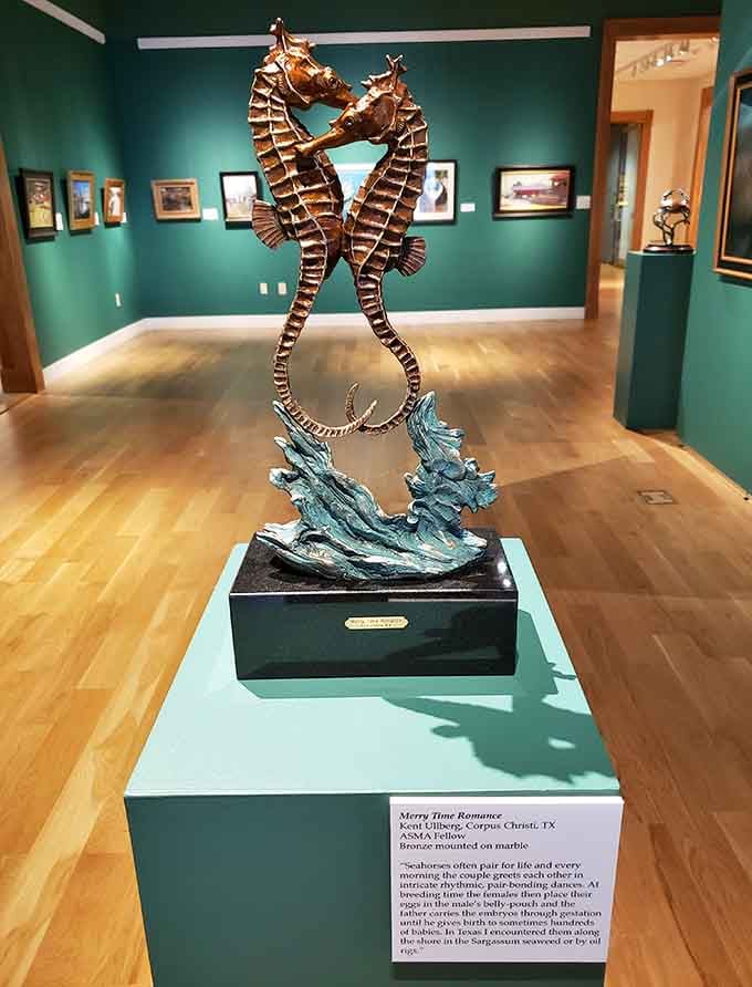 Two bronze seahorses dancing together on marble. Turns out romance looks pretty spectacular when it's cast in metal.