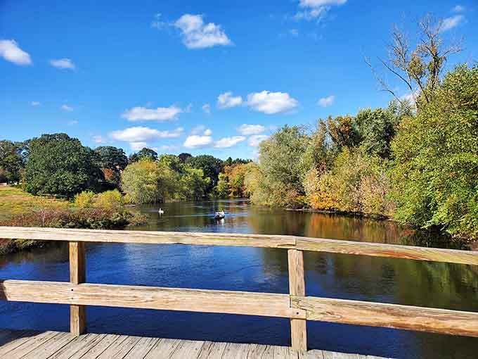 Peaceful waters reflect autumn colors, offering kayakers a serene paddle through landscapes that witnessed revolutionary chaos.