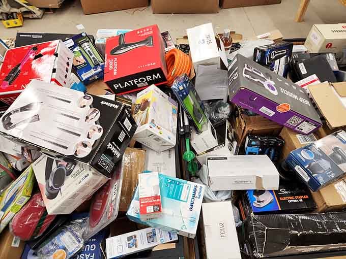 Philips Sonicare, electric staplers, garden hoses, and headphones all sharing the same bin like old friends.