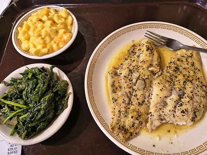 Broiled fish alongside creamy mac and cheese and sautéed spinach. Southern comfort food dressed in its Sunday best.