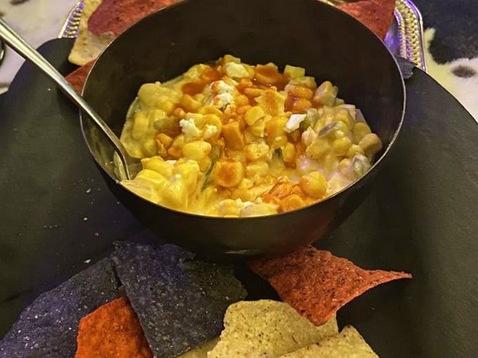 Mexican street corn dip with rainbow chips: proof that appetizers can be both Instagram-worthy and delicious.