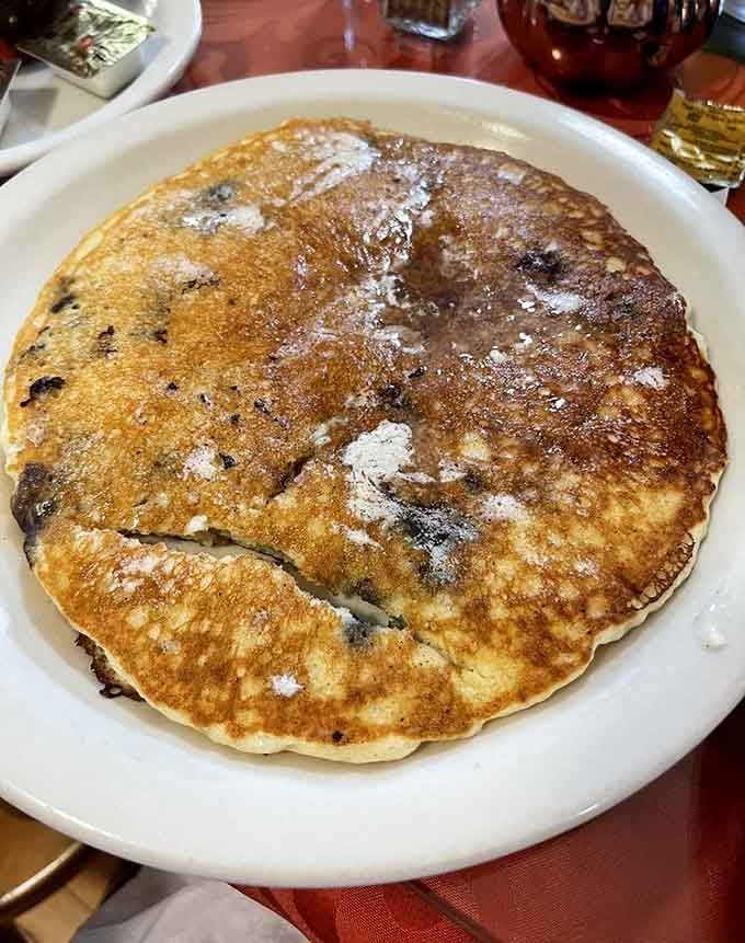 One blueberry pancake so large it's basically a conversation starter. Add syrup and prepare to stop talking entirely.