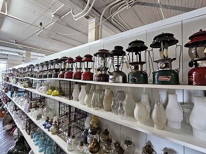 An entire wall of vintage lanterns, because apparently one Coleman just wasn't going to cut it.