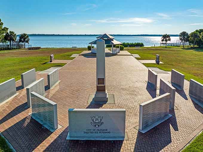 The Veterans Memorial stands proud against bay waters, honoring service with dignity and waterfront serenity combined beautifully.