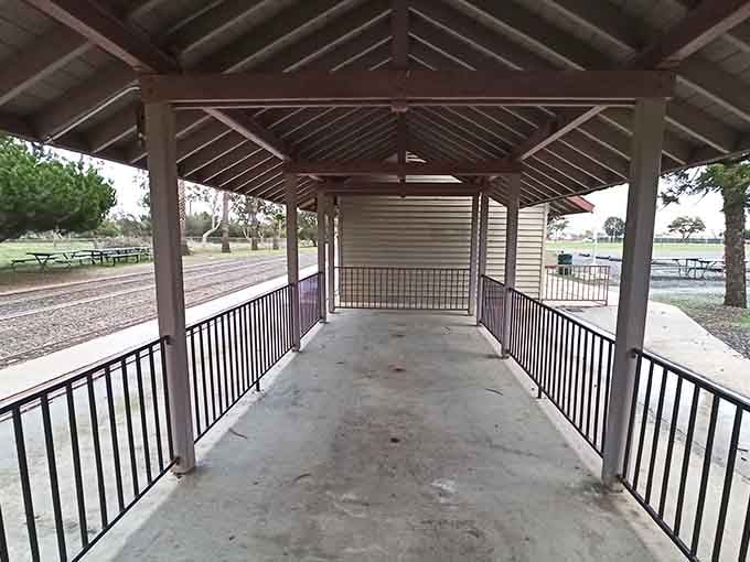 This covered platform offers shade while you wait—because even miniature train stations need proper amenities.