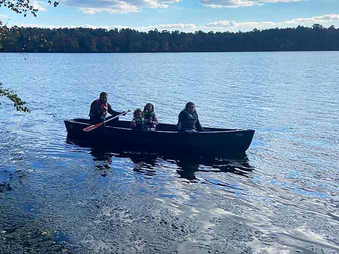 A family rowing across Parvin Lake on a crisp autumn day. This is what unplugging actually looks like.