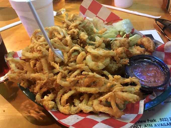 A mountain of crispy onion straws that could make even the most devoted salad enthusiast reconsider their life choices.