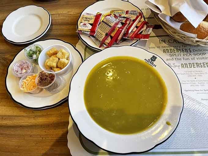 The Traveler's Special arrives like a full orchestra, soup, toppings, crackers, and fresh rolls all playing together beautifully.