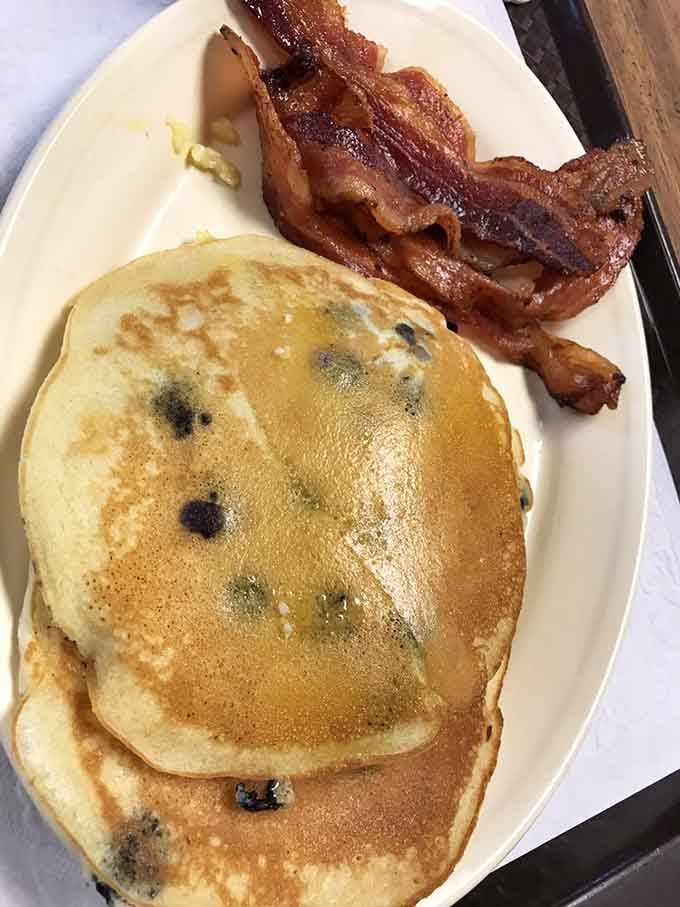 Blueberry pancakes and crispy bacon on the same plate. Breakfast doesn't get more straightforward or more satisfying than this right here.