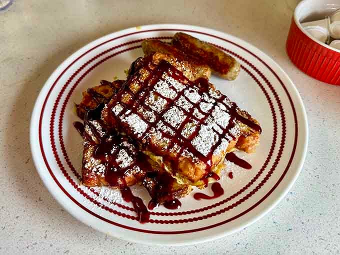 French toast drizzled with chocolate sauce and dusted with powdered sugar, because sometimes breakfast should feel like dessert.