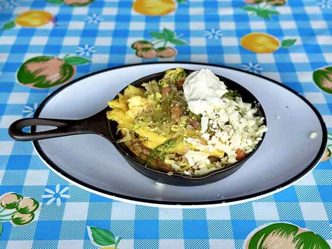 The Hola Taco Skillet arrives in cast iron glory, loaded with flavors that dance across your palate.