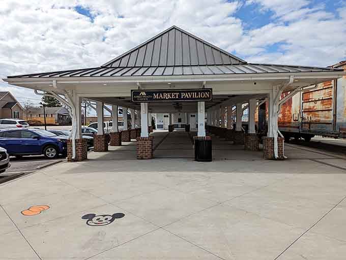 The Market Pavilion stands ready for business, a covered gathering spot that even Mickey Mouse approves of.