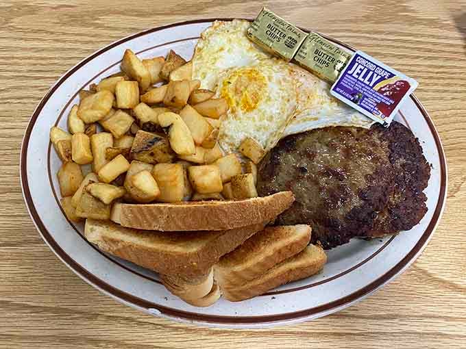 Eggs, home fries, and toast on one plate, a classic combination that never needs an apology.
