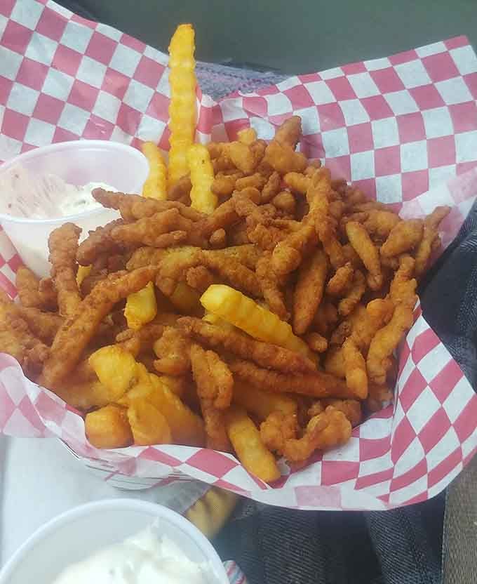 Golden fried clam strips in a basket. Crispy, generous, and completely unexpected at a drive-in.
