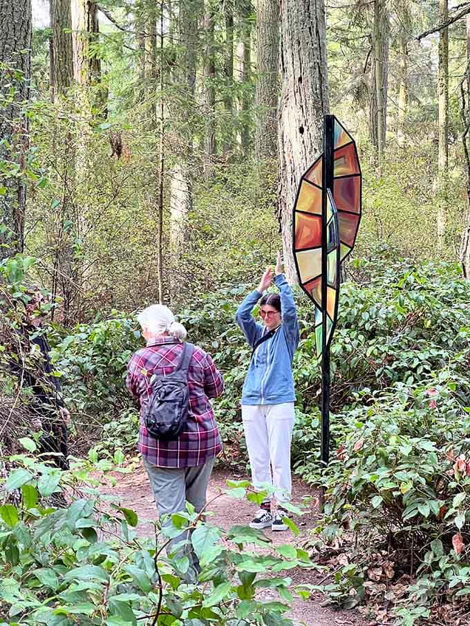 A stained-glass leaf sculpture catches warm autumn tones, proving that even a single piece here earns a long, slow look.