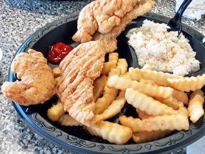 Golden chicken tenders, crinkle fries, and a scoop of slaw. Simple, honest, and completely satisfying every single time.