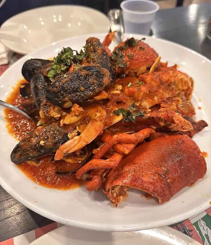 Lobster, mussels, and clams piled together in a fiery fra diavolo sauce, this dish doesn't whisper, it announces itself.