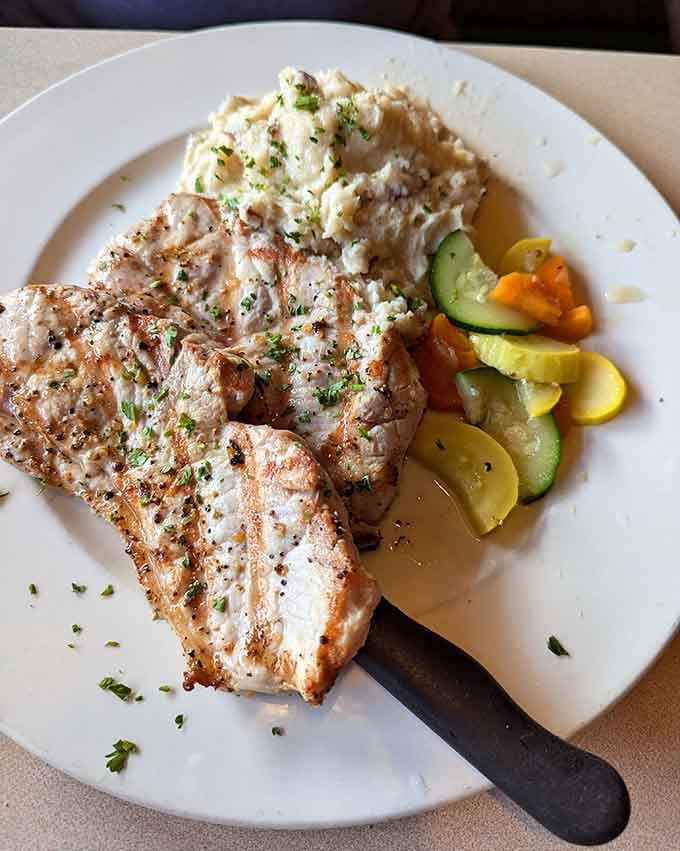 Grilled pork chops with mashed potatoes and vegetables. Simple, honest, and exactly what a Tuesday evening deserves.