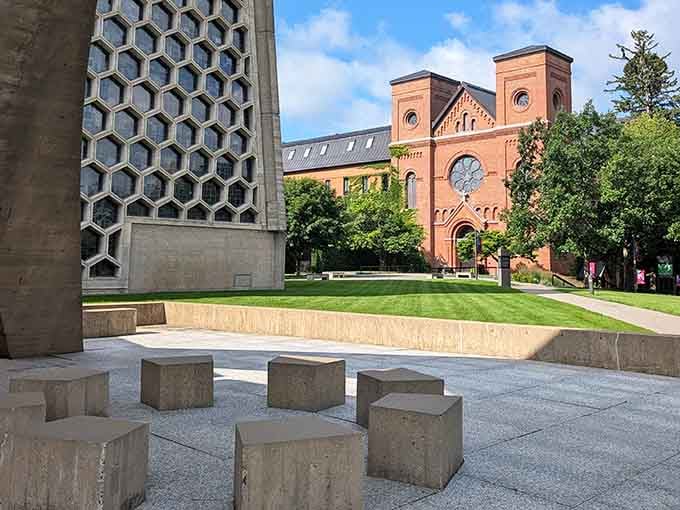 The old brick church stands proudly next to its concrete cousin, like architectural generations peacefully coexisting on the same family estate.