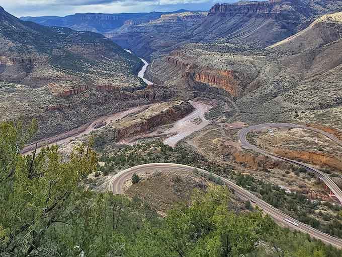 Those serpentine curves winding through layered cliffs make every GPS-obsessed highway seem utterly boring by comparison.