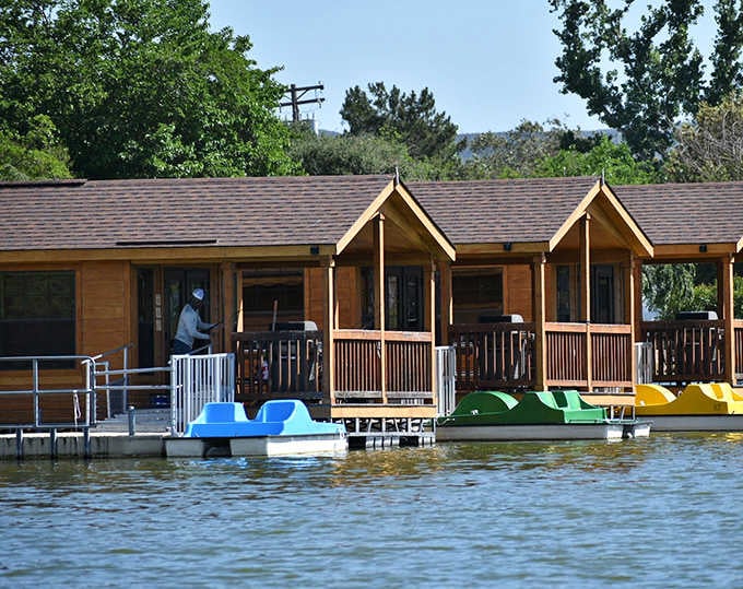 Colorful paddle boats waiting by the cabin deck are basically an invitation to relive your childhood summer camp glory days.
