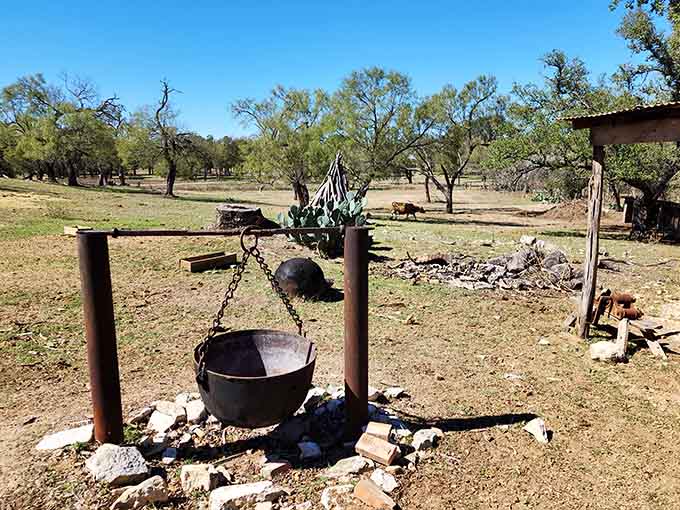 That cast iron cauldron over an open fire means someone is doing serious, no-shortcuts cooking today.