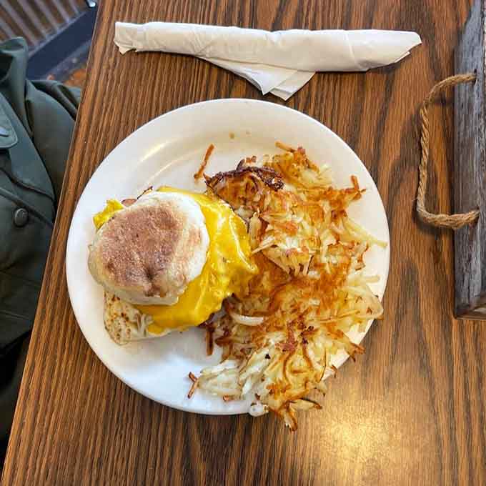 A perfectly simple egg sandwich with golden hashbrowns on the side. Sometimes the classics just hit differently.